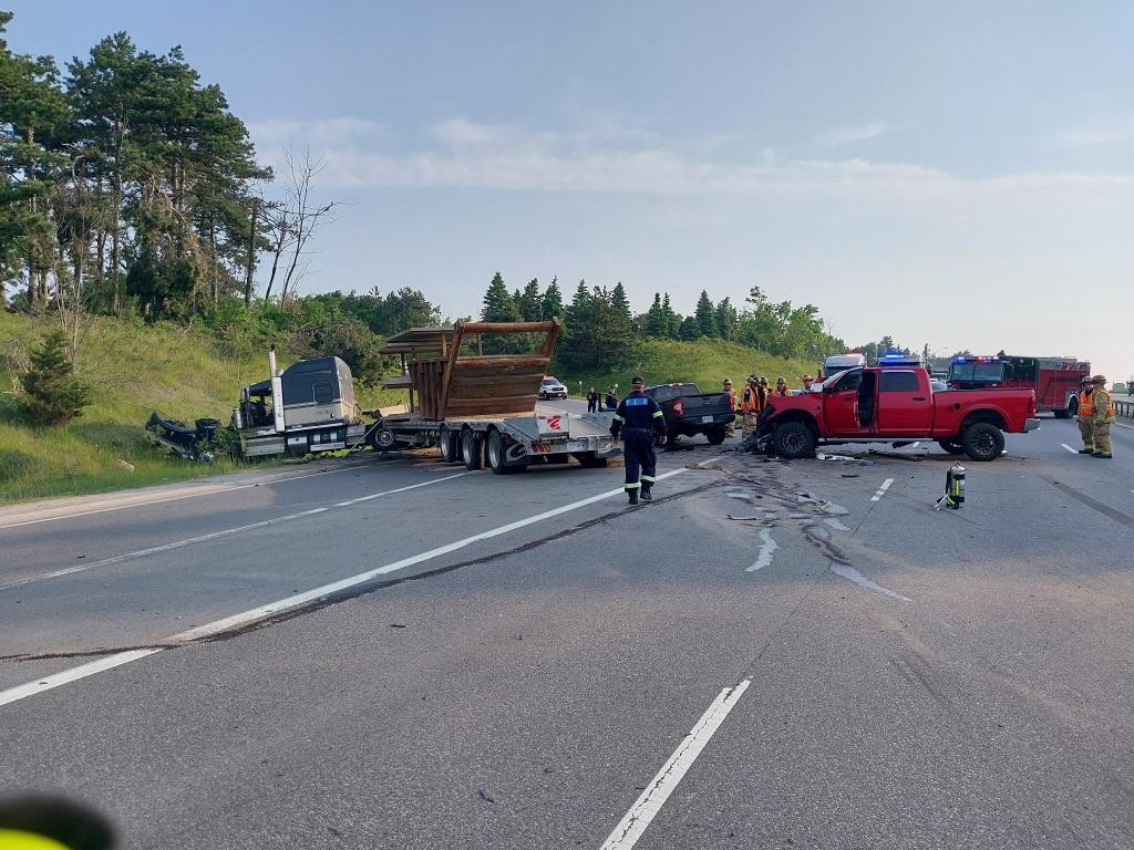 Transport truck plows through guardrail forcing lane closures on Highway 400 in Barrie