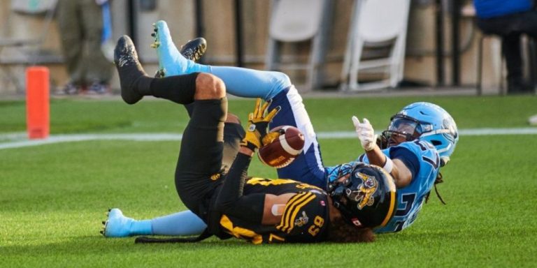 Veteran Bo Levi Mitchell throws five TD strikes to lead Ticats past ...