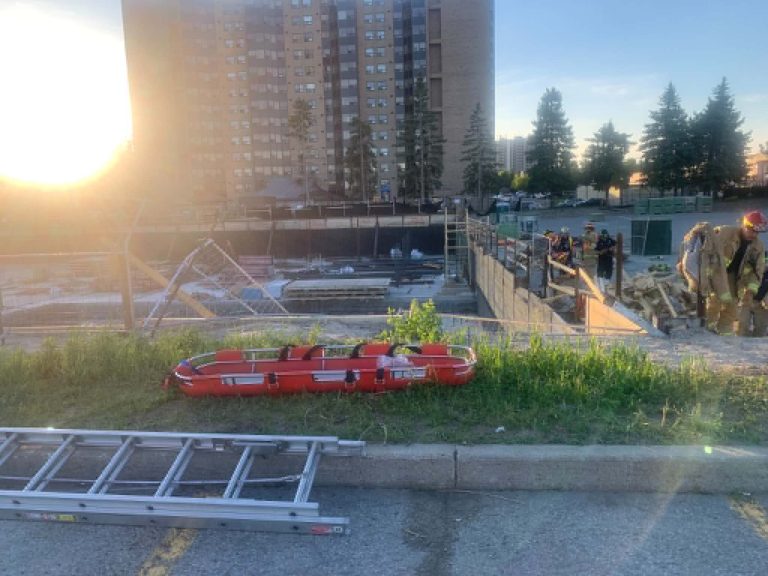 Vehicle crashes through fence, falls about 140 metres into construction ...